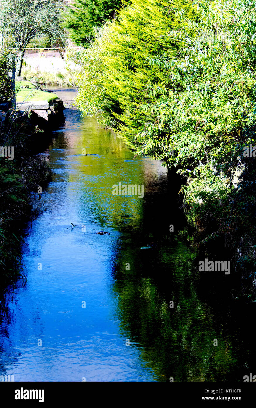 Urban watercourse, stream through a town Stock Photo - Alamy