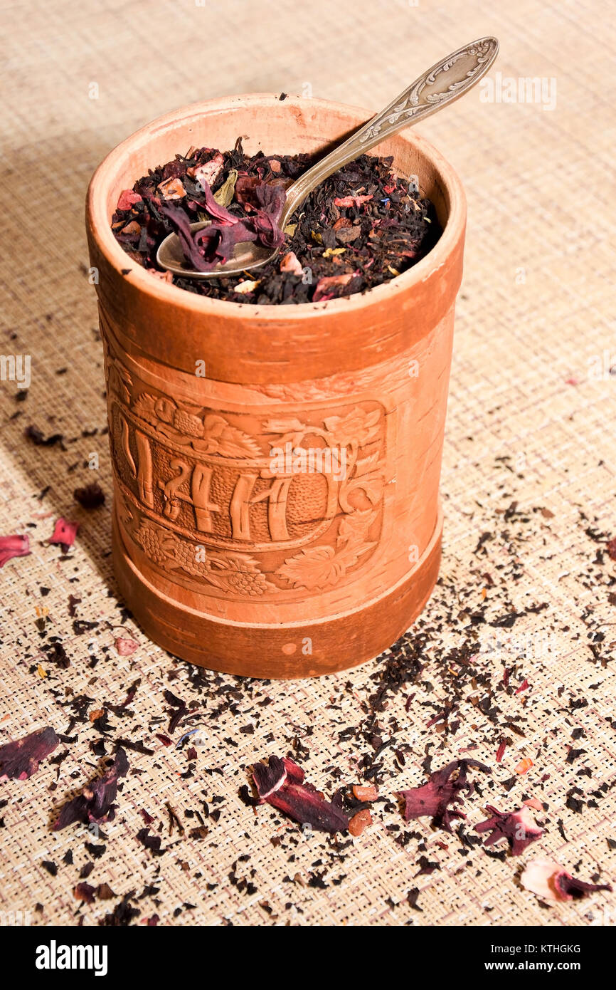 Red tea (karkade) on the table with a spoon Stock Photo - Alamy