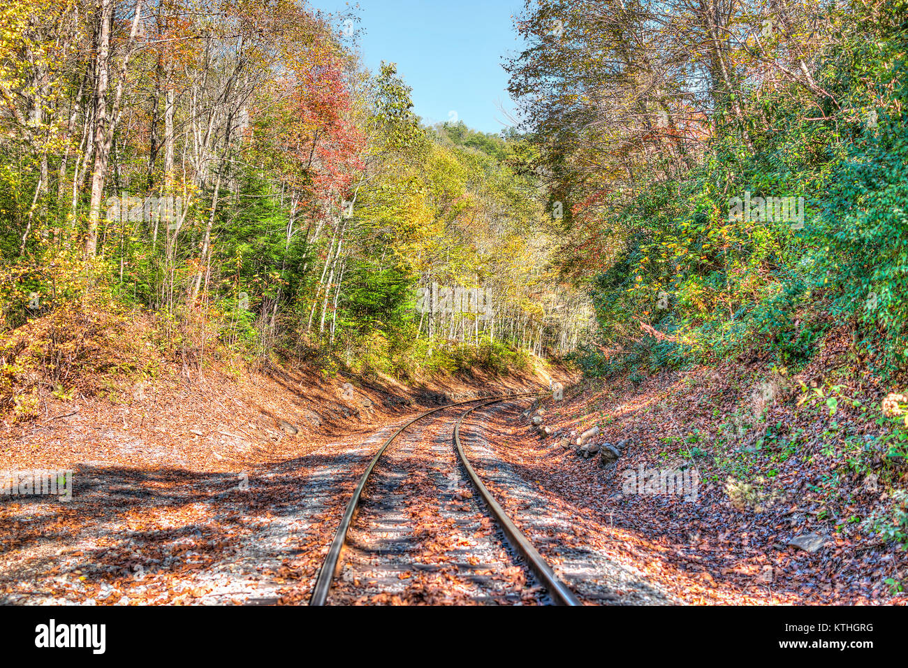 Railroad tracks in autumn fall in West Virginia with golden foliage ...