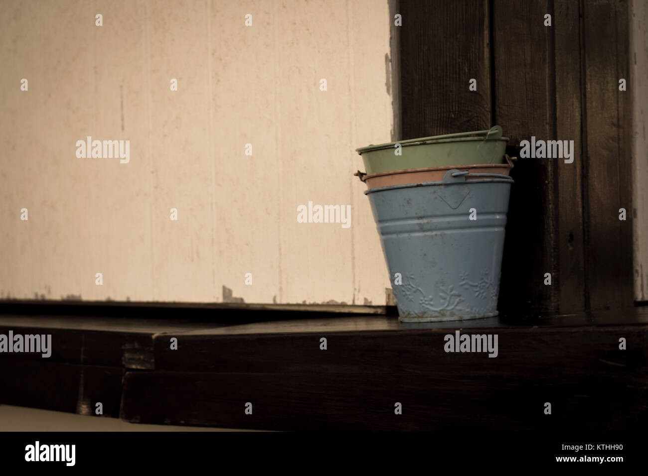Metal buckets. Three old decorative metal buckets Stock Photo - Alamy