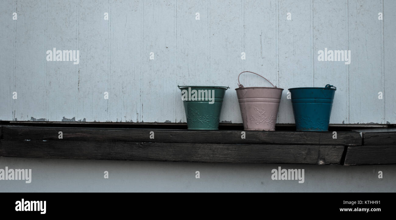 Metal buckets. Three old decorative metal buckets Stock Photo - Alamy