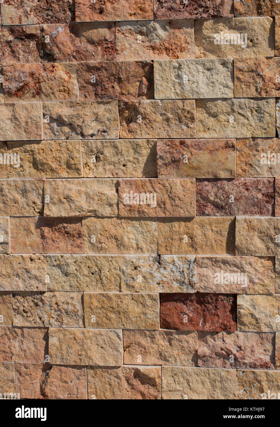 Decorative cubic stone wall as background texture Stock Photo - Alamy