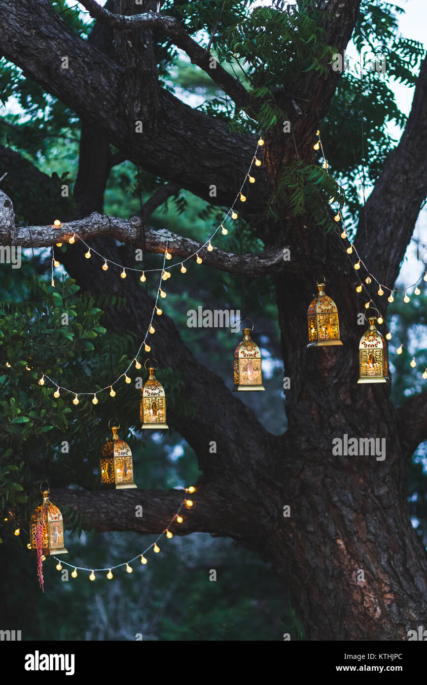 Night wedding ceremony with a lot of candles and vintage lamps on big ...