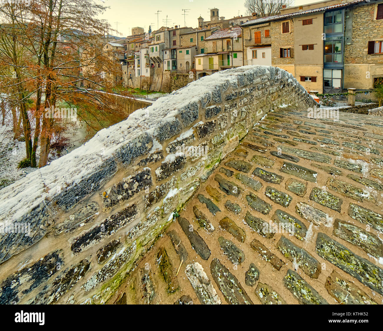 view from ncient medieval donkey-back bridge with a unique arch in a ...