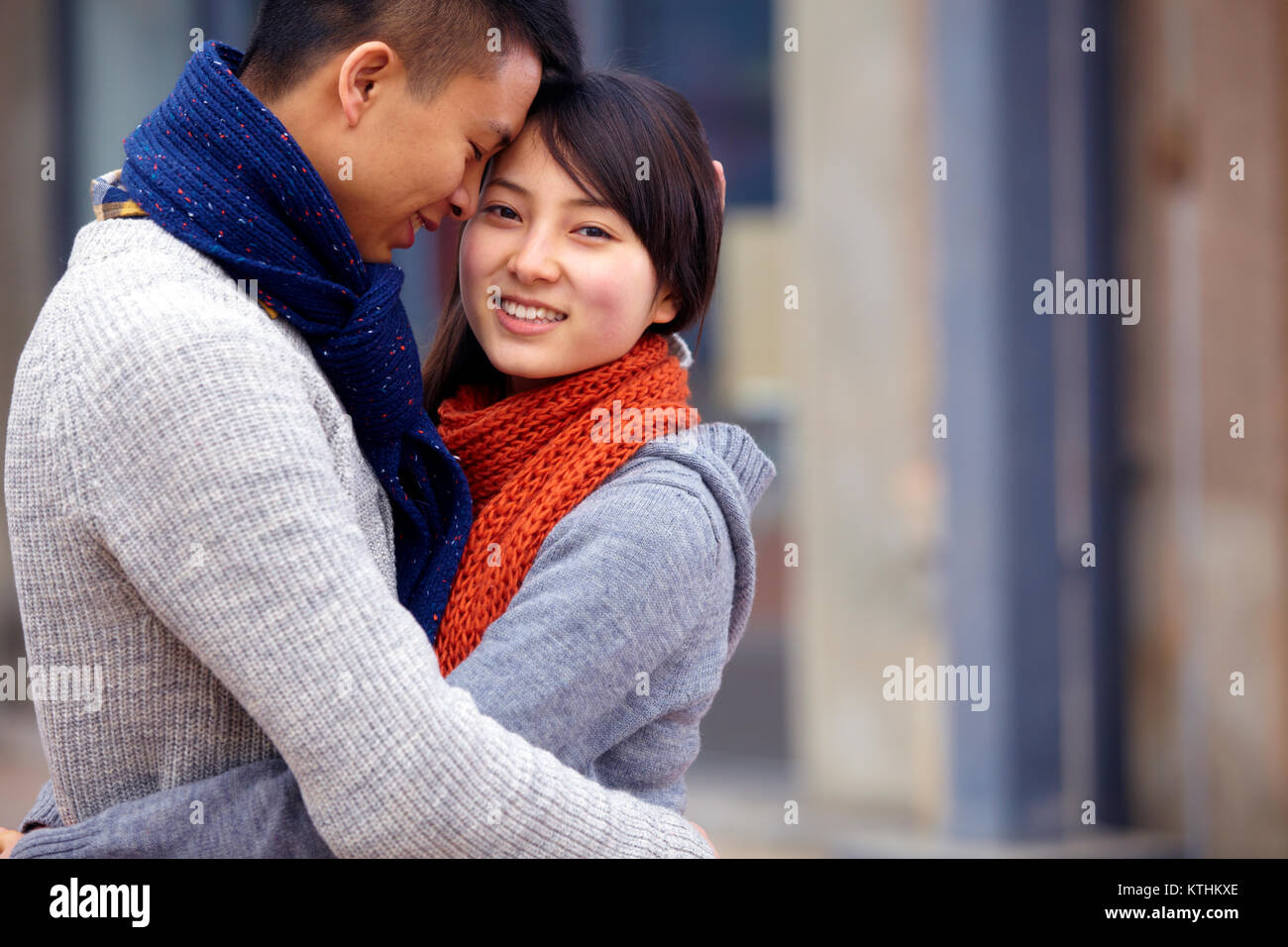 young Chinese man and woman holding together Stock Photo - Alamy