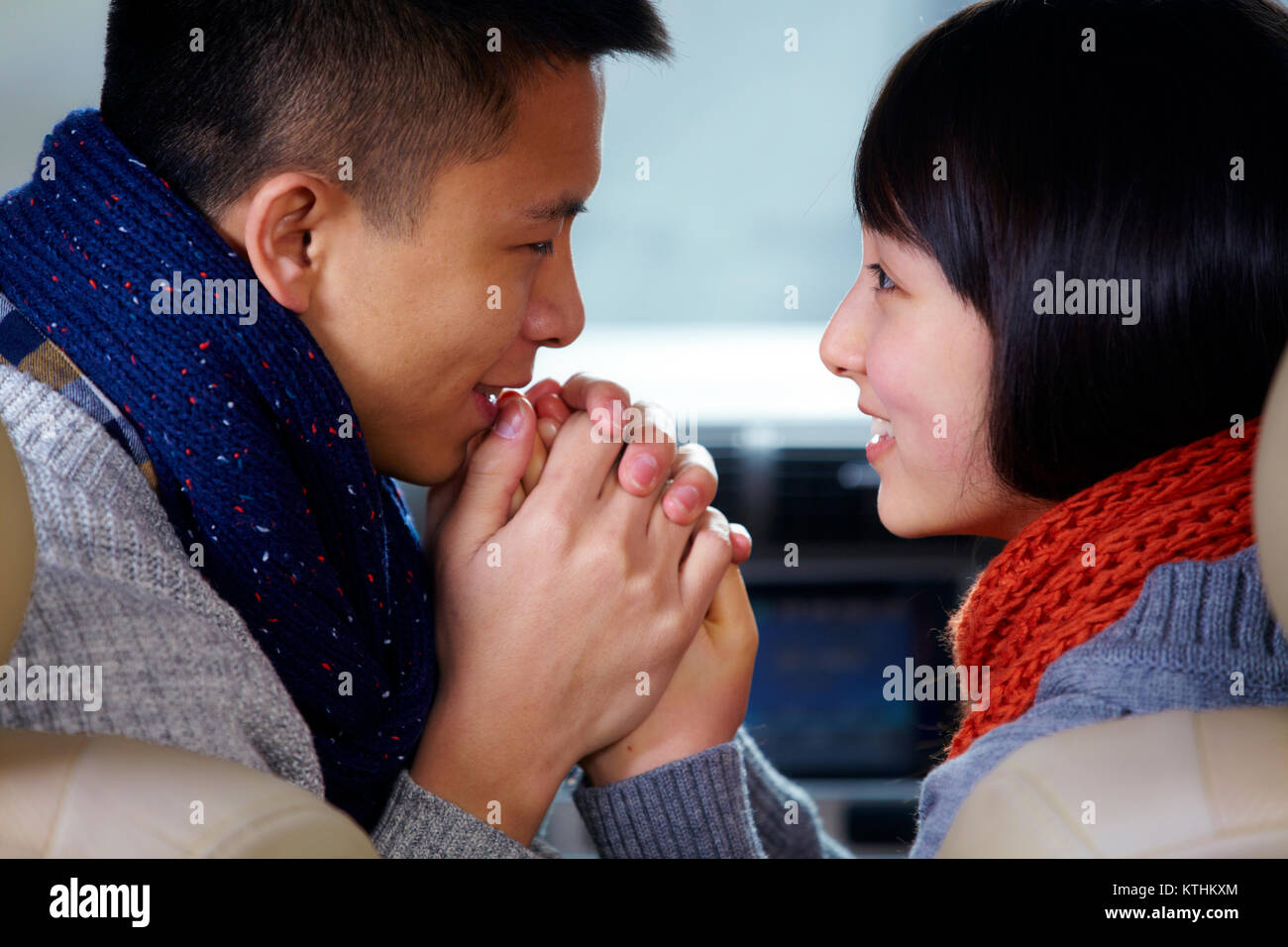 young Chinese man and woman holding together Stock Photo - Alamy