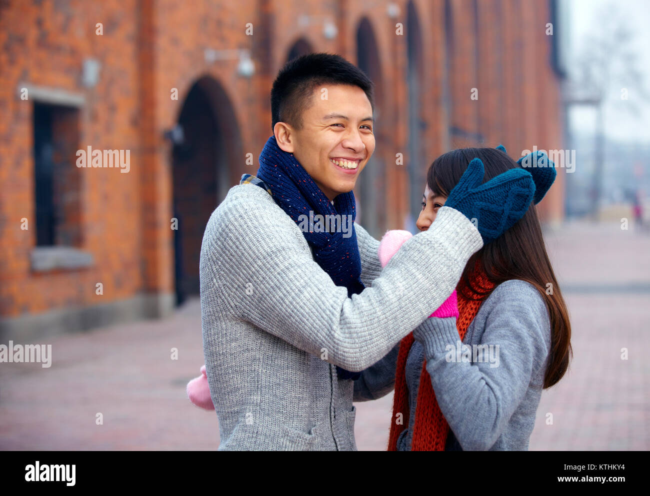 young Chinese man and woman holding together Stock Photo - Alamy