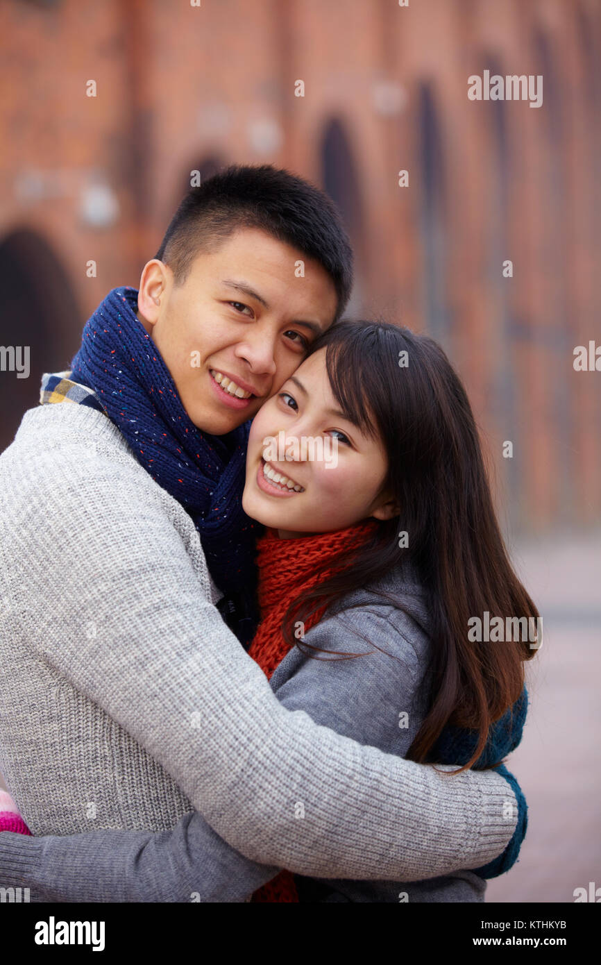 young Chinese man and woman holding together Stock Photo - Alamy