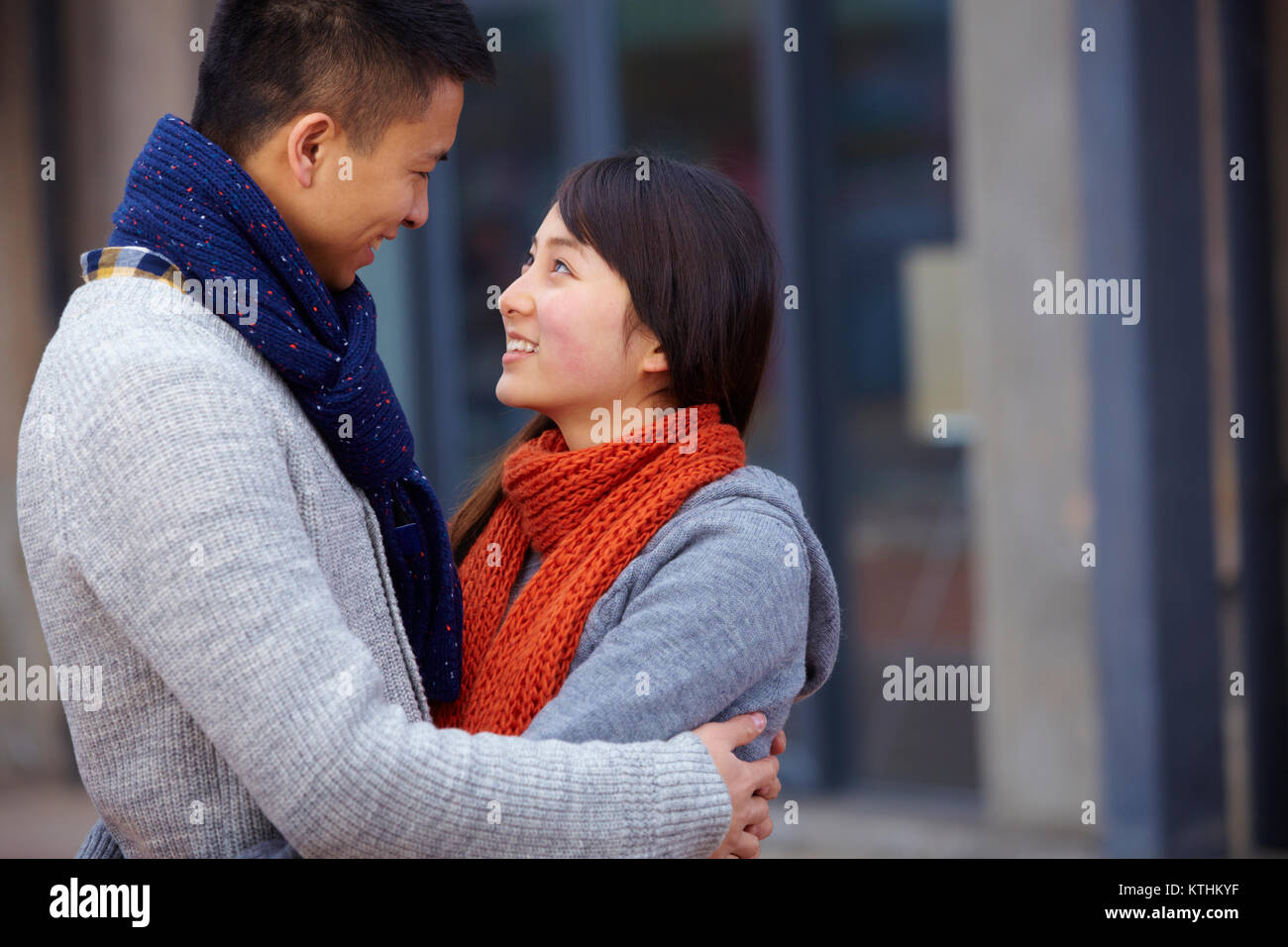 young Chinese man and woman holding together Stock Photo - Alamy