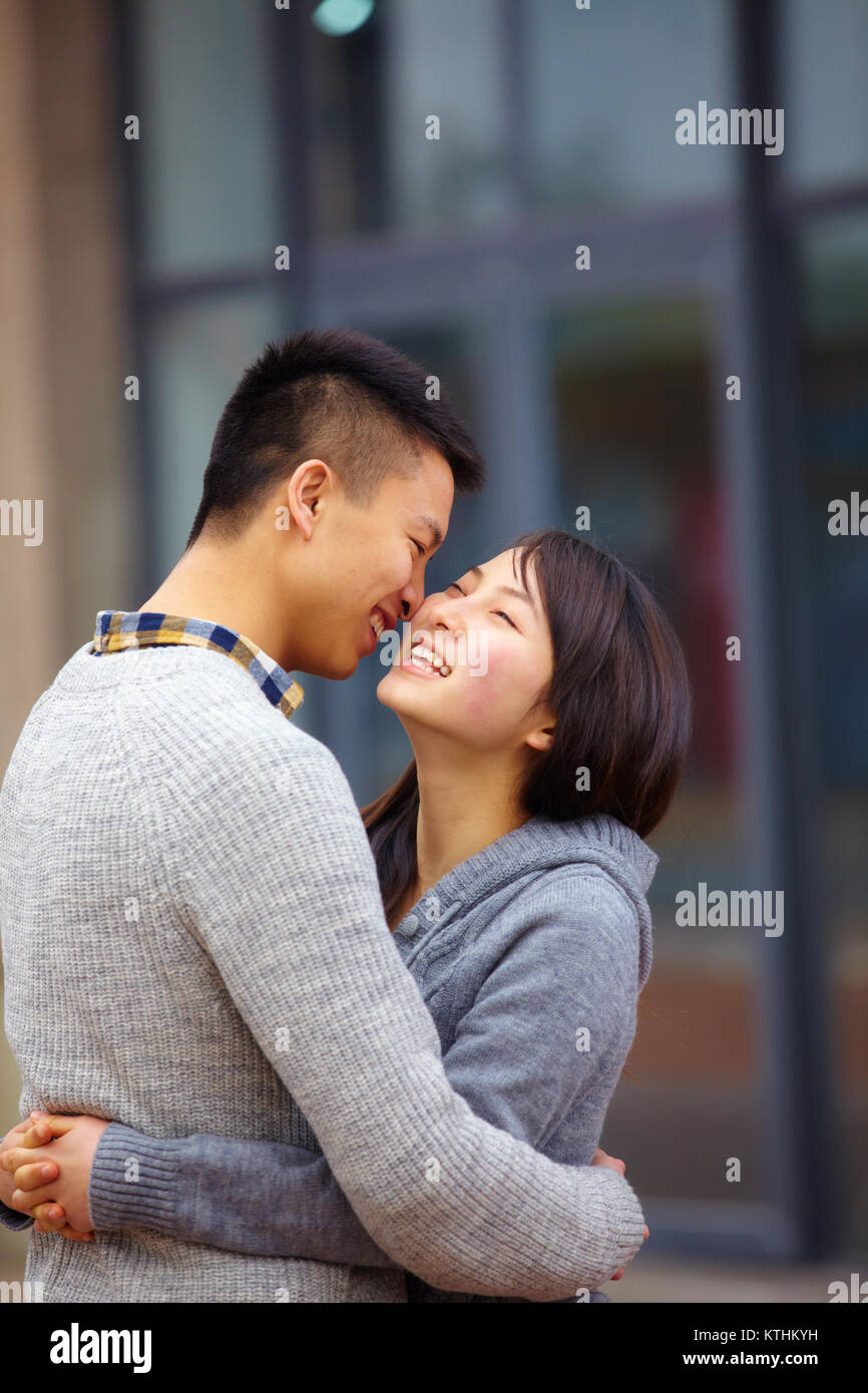 young Chinese man and woman holding together Stock Photo - Alamy