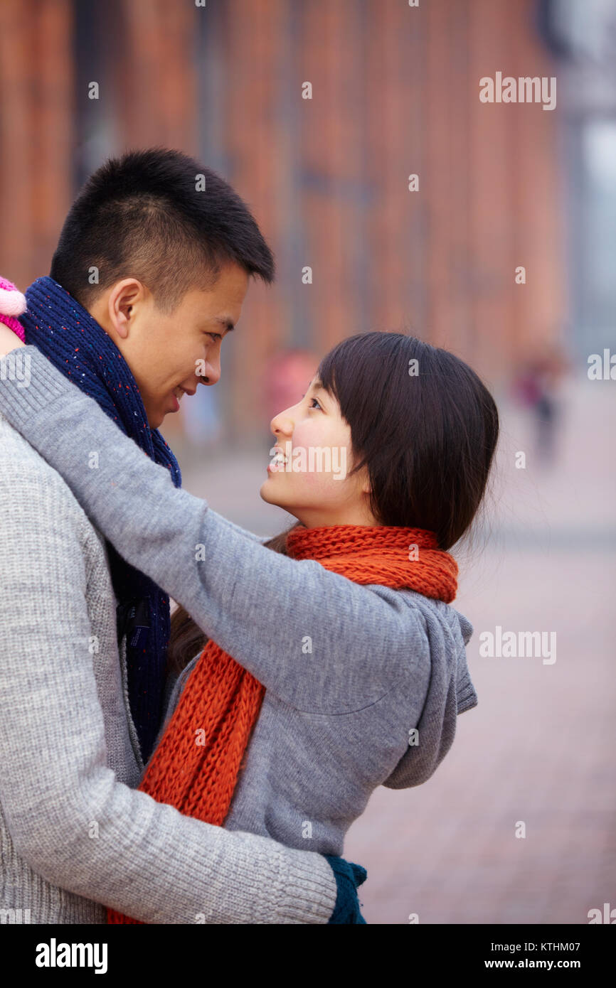 young Chinese man and woman holding together Stock Photo - Alamy