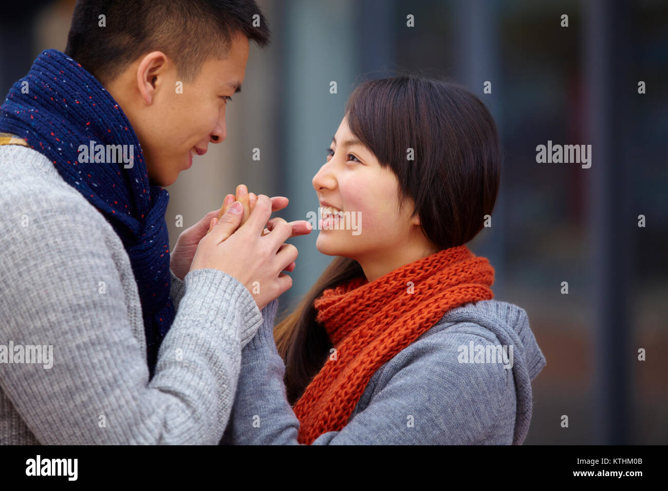 young Chinese man and woman holding together Stock Photo - Alamy