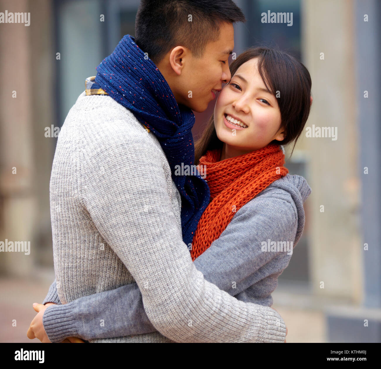 young Chinese man and woman holding together Stock Photo - Alamy