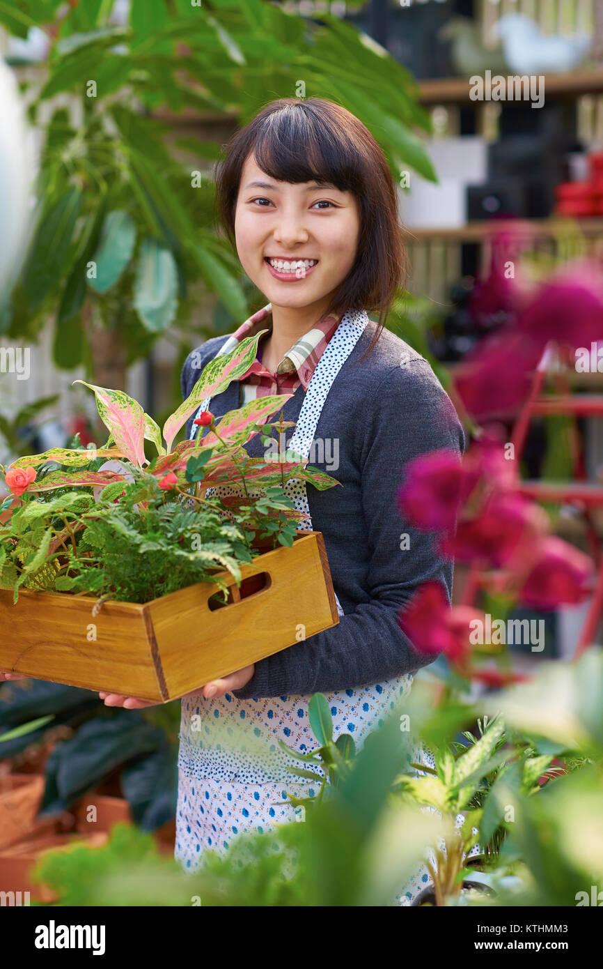 One Beautiful Chinese Woman Working in the Florist's Smile at Camera ...