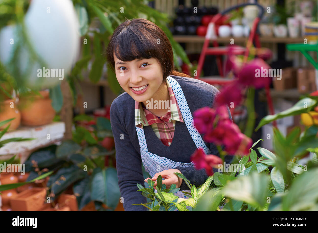 One Beautiful Chinese Woman Working in the Florist's Smile at Camera ...