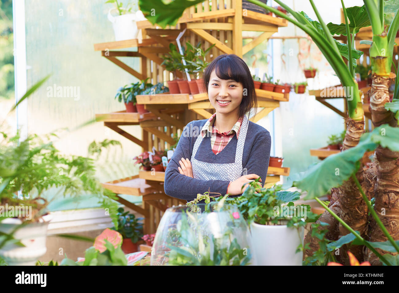One Beautiful Chinese Woman Working in the Florist's Smile at Camera ...