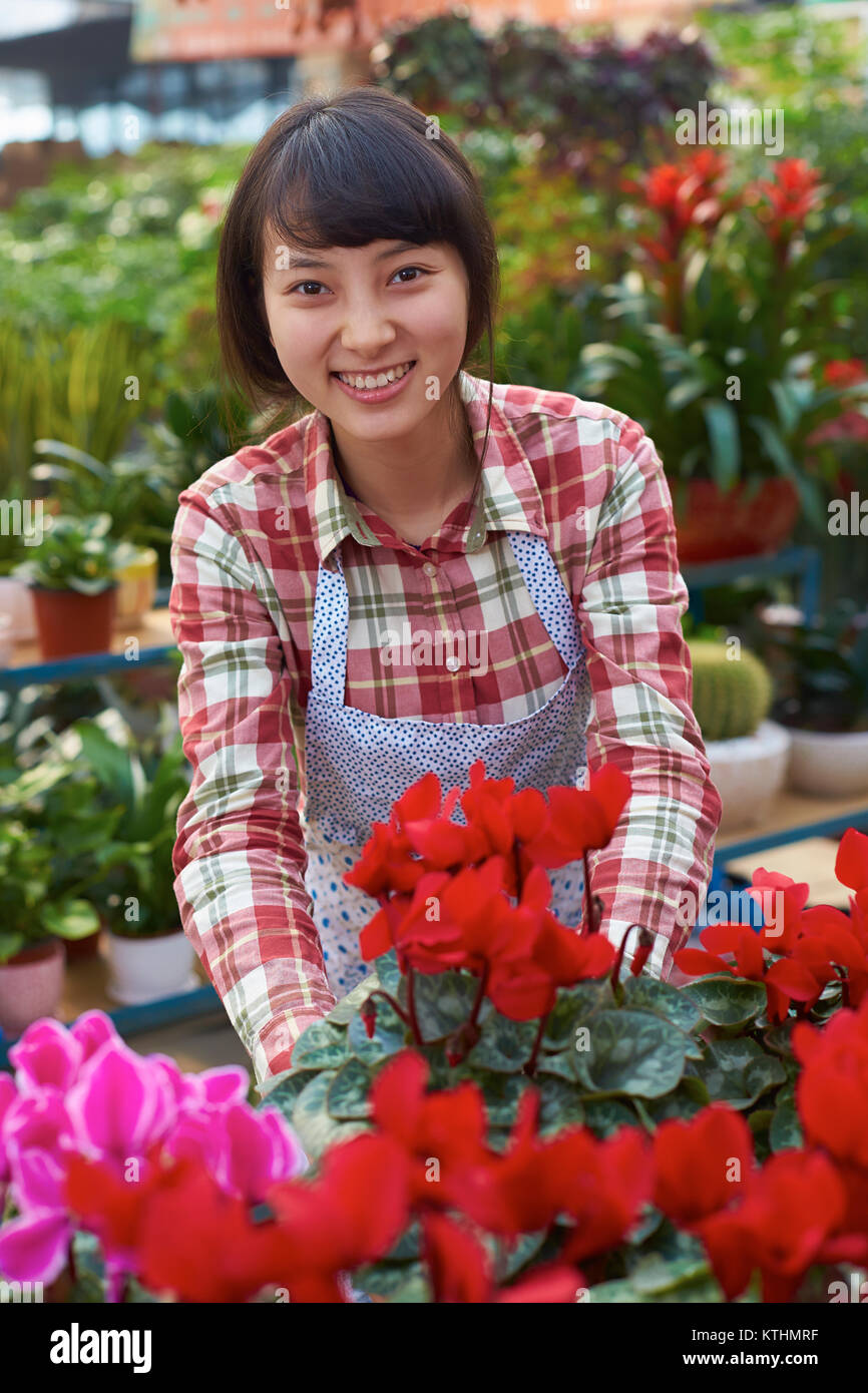 One Beautiful Chinese Woman Working in the Florist's Smile at Camera ...