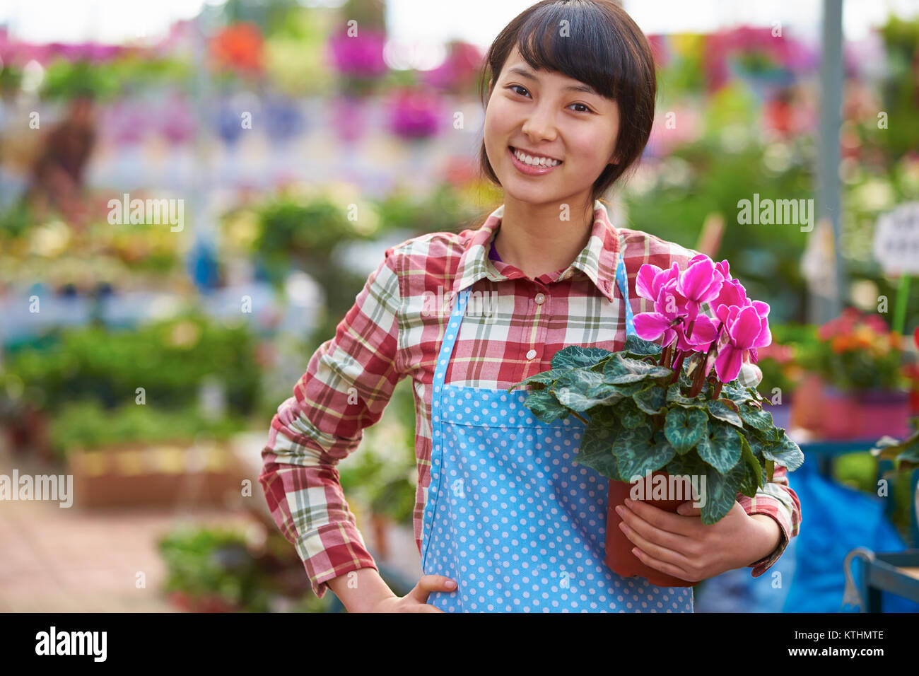 One Beautiful Chinese Woman Working in the Florist's Smile at Camera ...