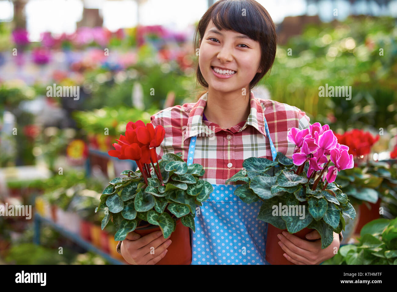 One Beautiful Chinese Woman Working in the Florist's Smile at Camera ...