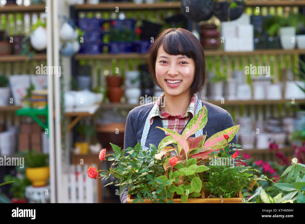 One Beautiful Chinese Woman Working in the Florist's Smile at Camera ...