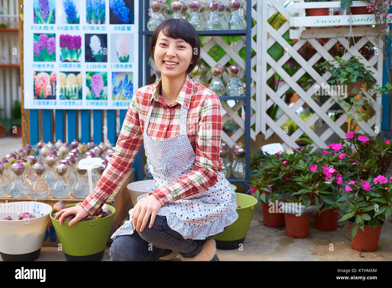 One Beautiful Chinese Woman Working in the Florist's Smile at Camera ...