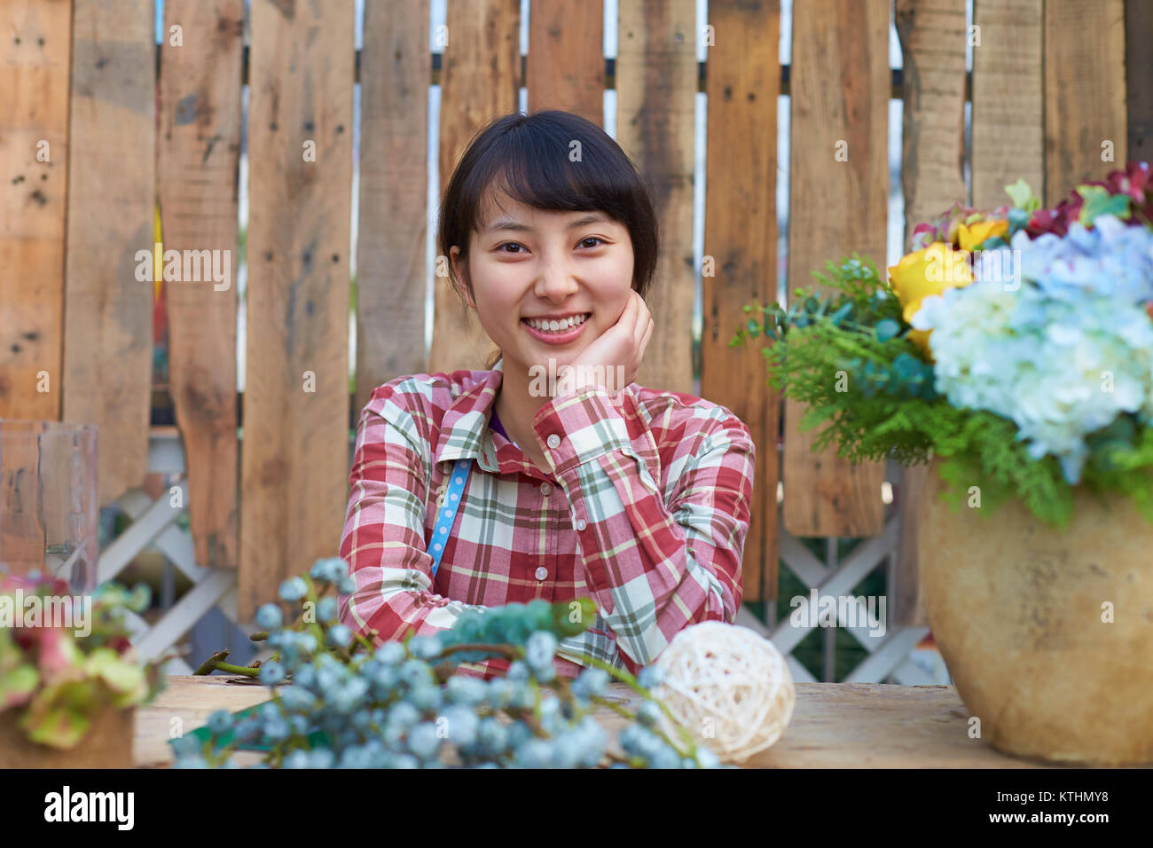 One Beautiful Chinese Woman Working in the Florist's Smile at Camera ...