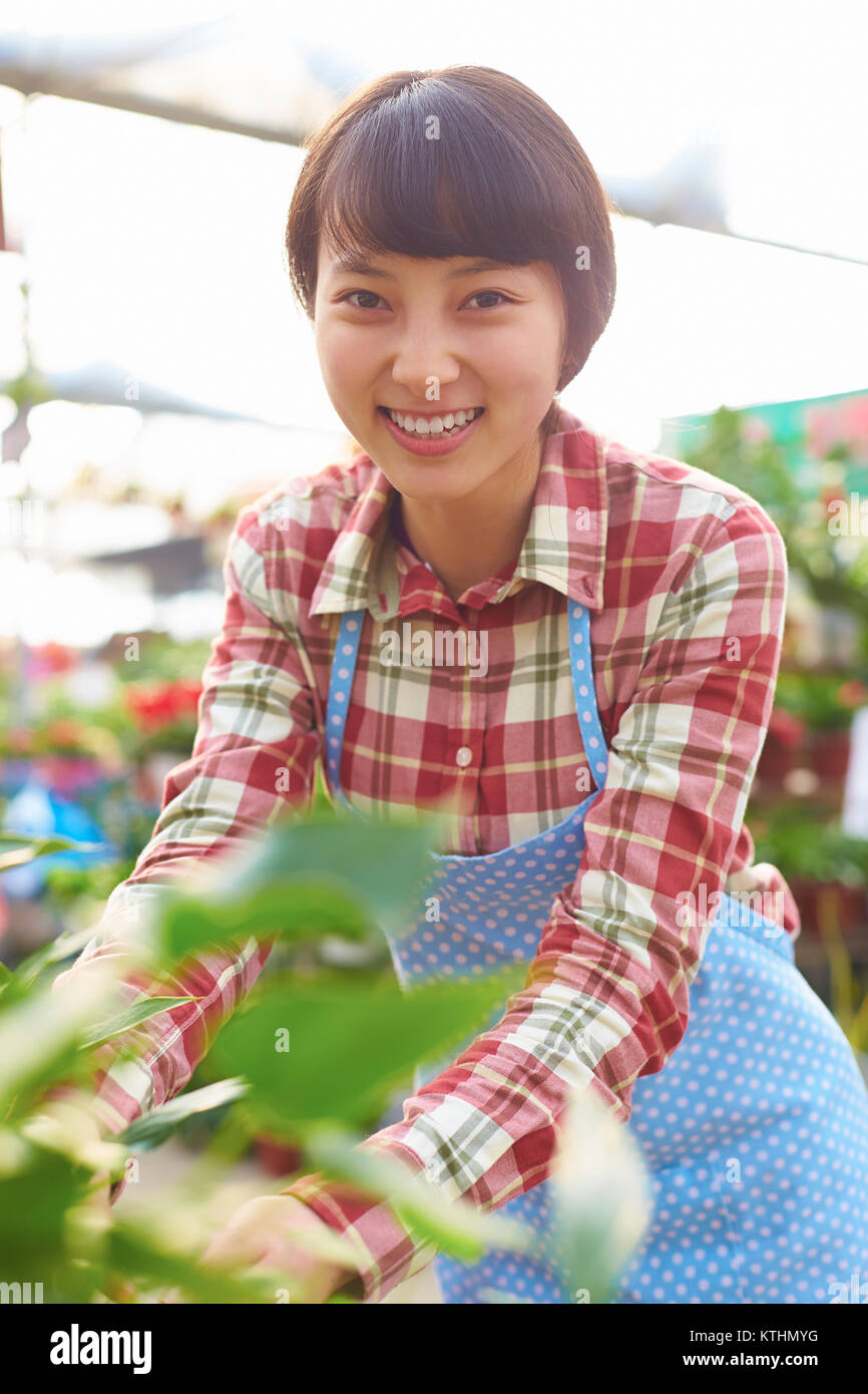 One Beautiful Chinese Woman Working in the Florist's Smile at Camera ...