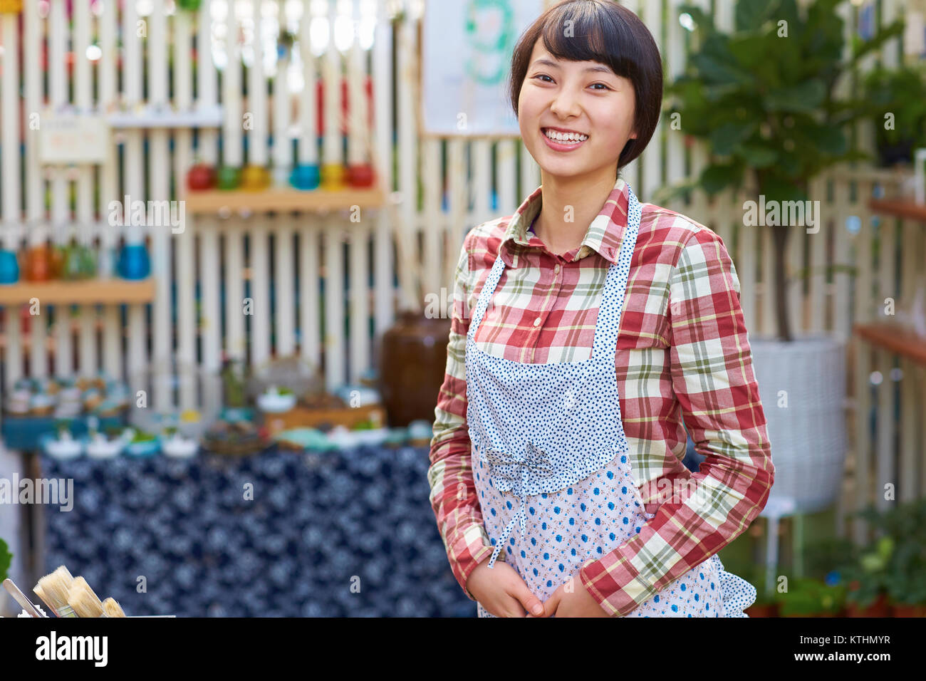 One Beautiful Chinese Woman Working in the Florist's Smile at Camera ...