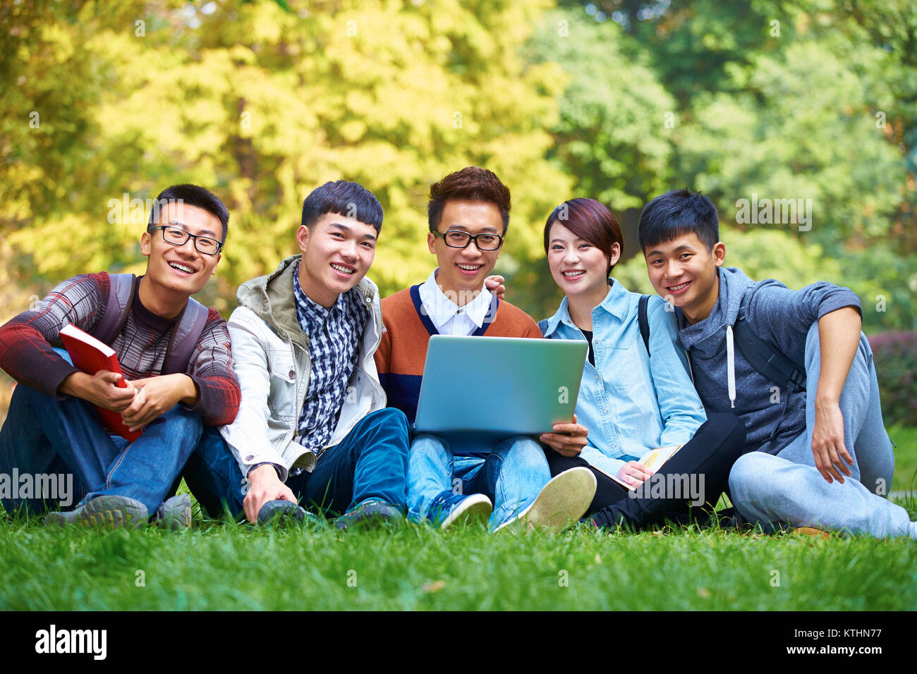 group of fice happy asian college students using laptop in campus Stock ...