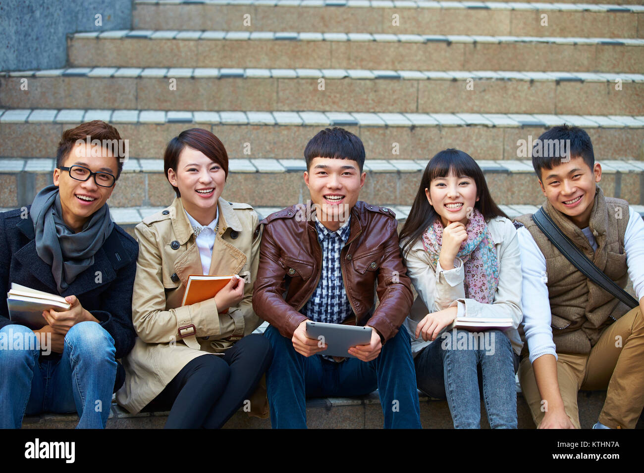 group of happy asian college students looking at camera smile in the ...