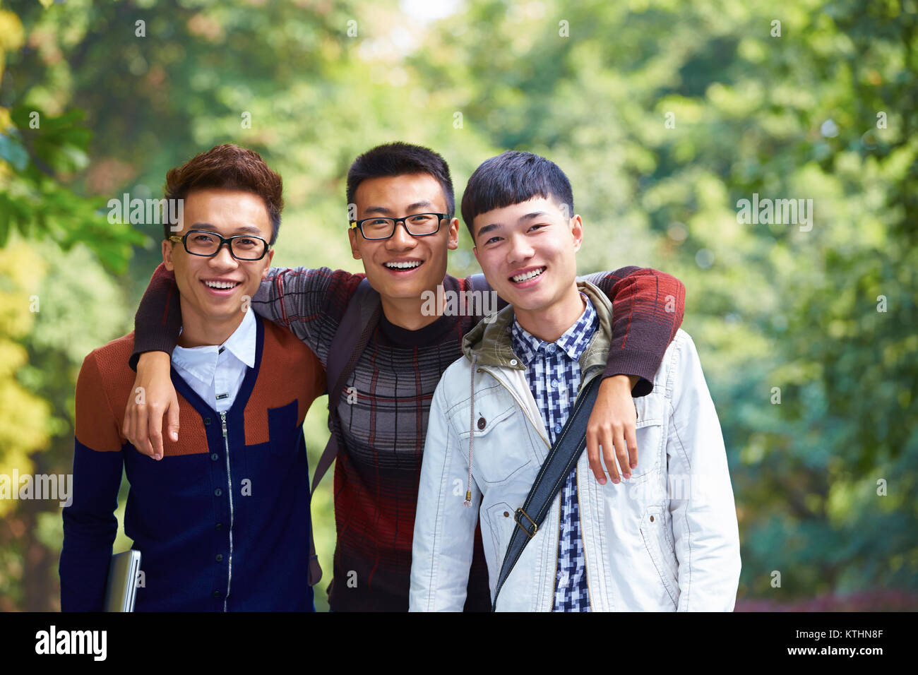 Three Happy Young Chinese College Students Looking at Camera Smile ...