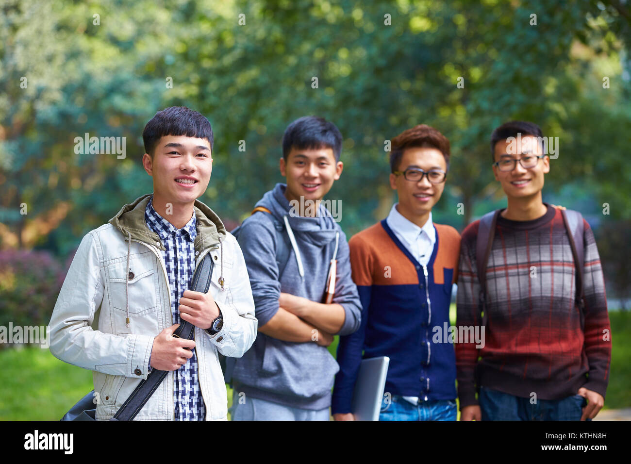group of happy asian college students looking at camera smile in the ...