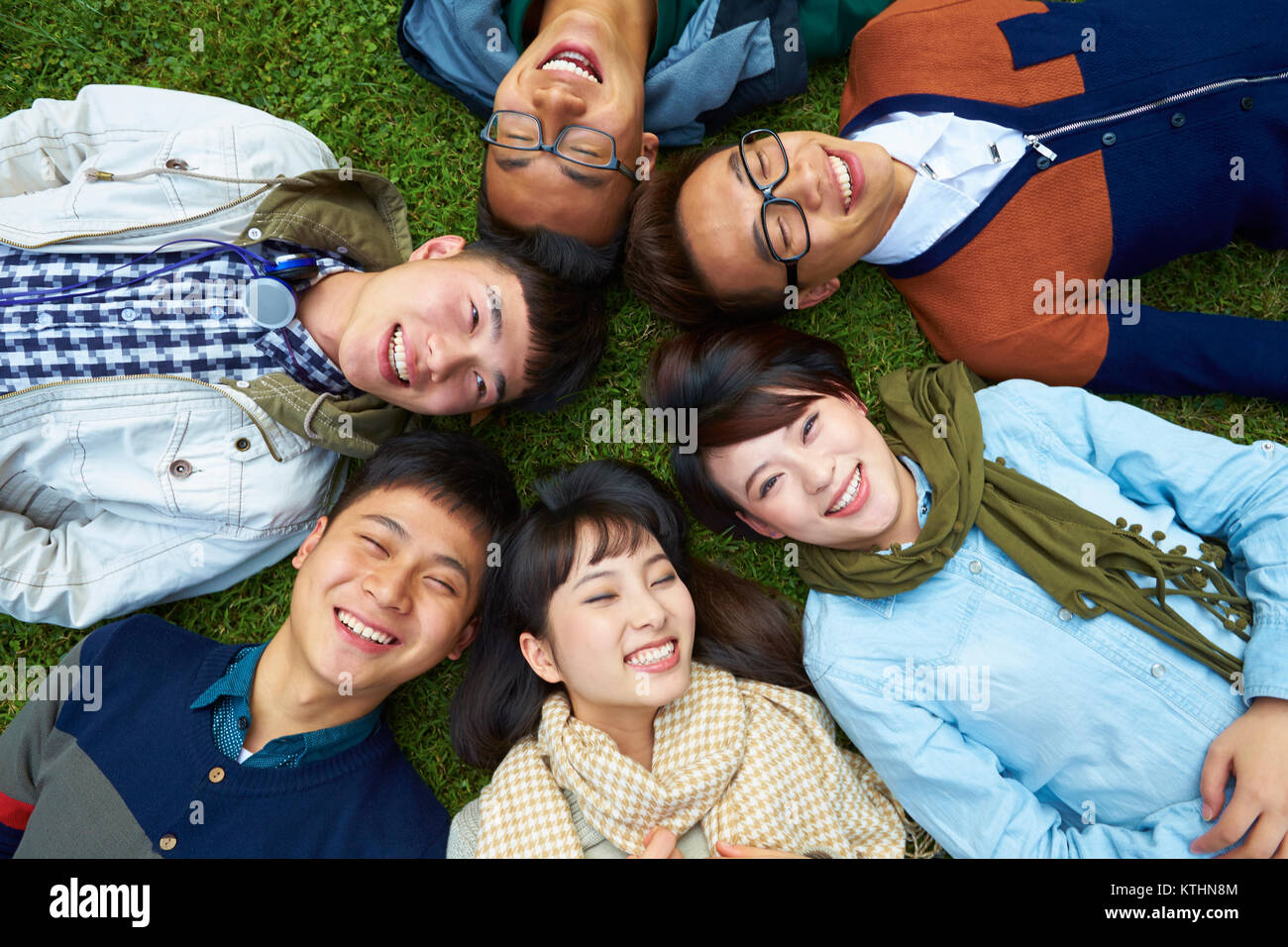 Group of Happy Chinese College Students Lying on Lawn Lokking up to the ...