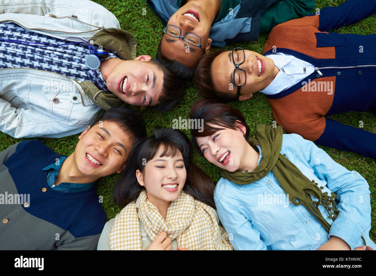Group of Happy Chinese College Students Lying on Lawn Lokking up to the ...