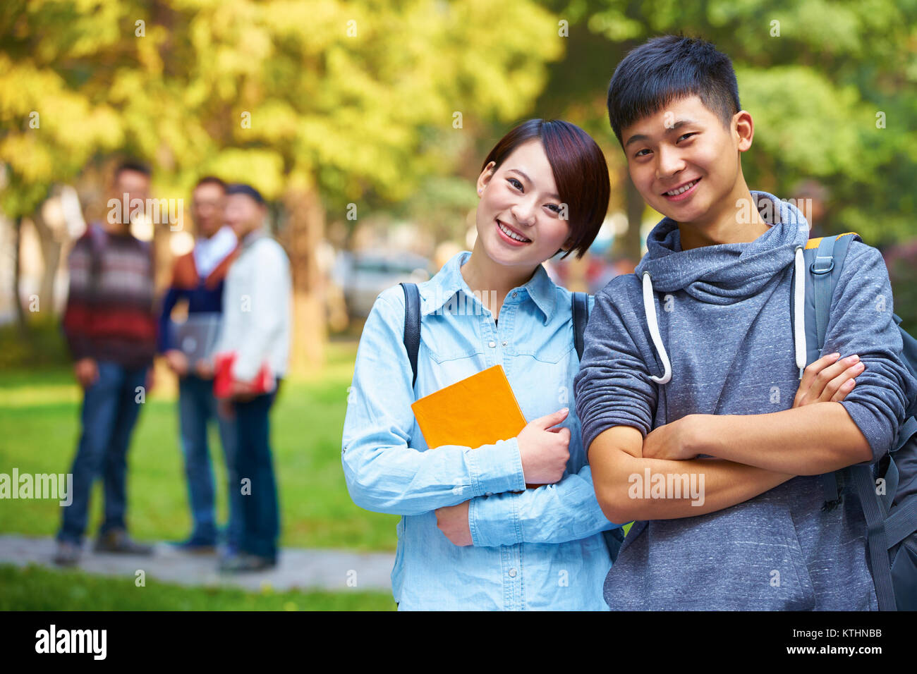 group of happy asian college students looking at camera smile in the ...