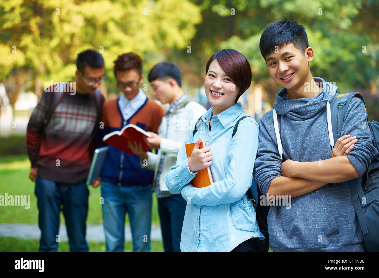 group of happy asian college students looking at camera smile in the ...