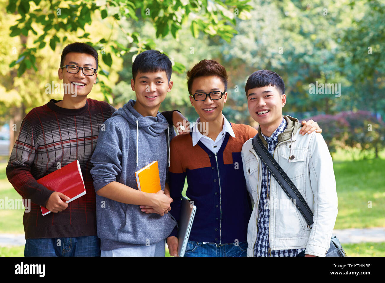 group of happy asian college students looking at camera smile in the ...