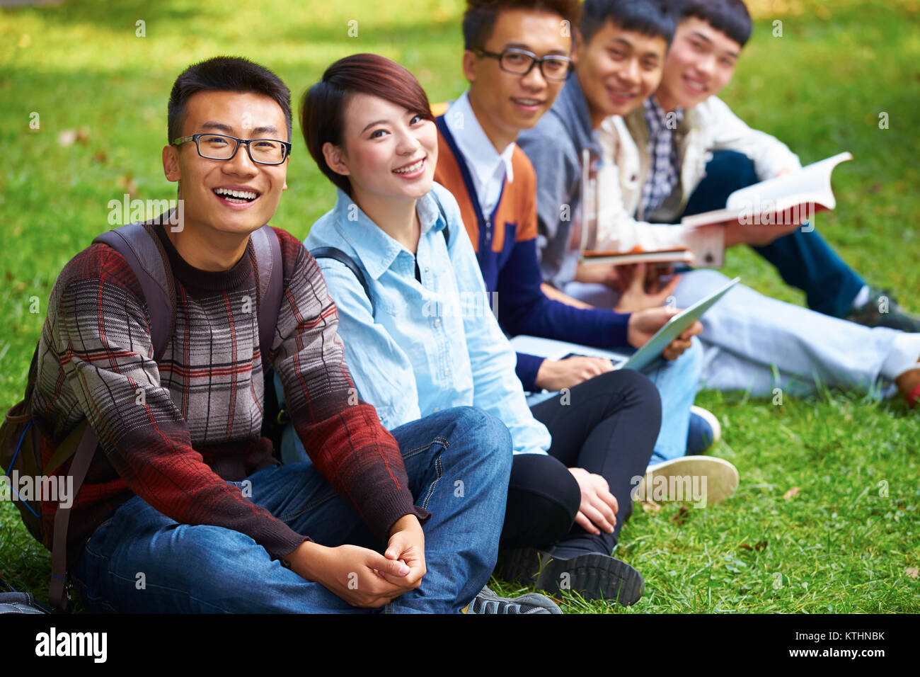 group of happy asian college students looking at camera smile in the ...