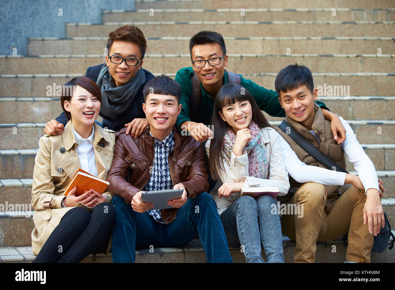 group of happy asian college students looking at camera smile in the ...
