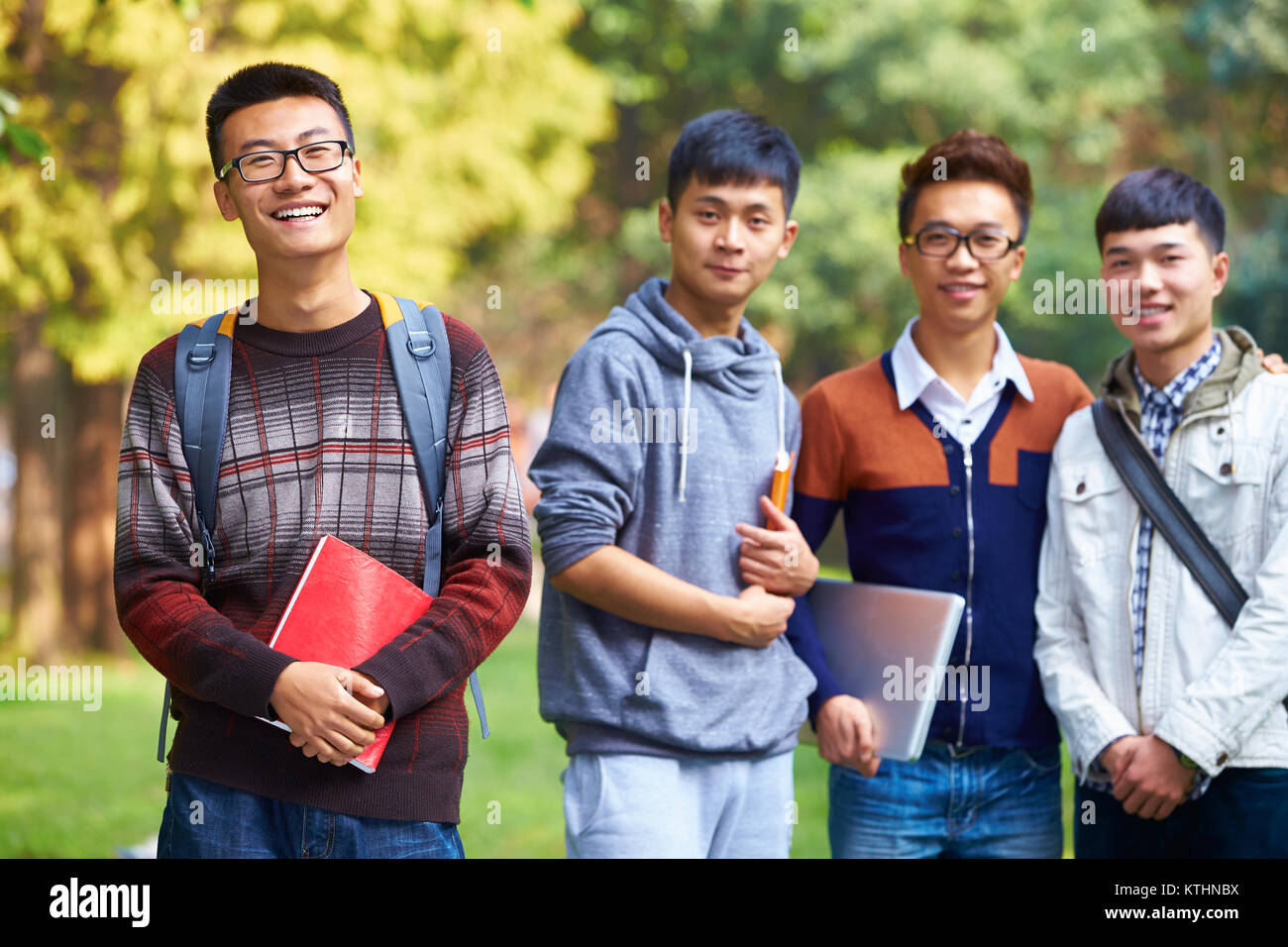 group of happy asian college students looking at camera smile in the ...