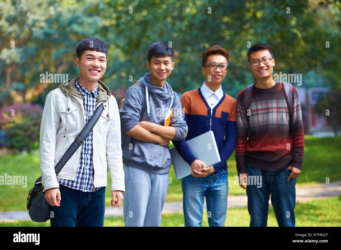group of happy asian college students looking at camera smile in the ...