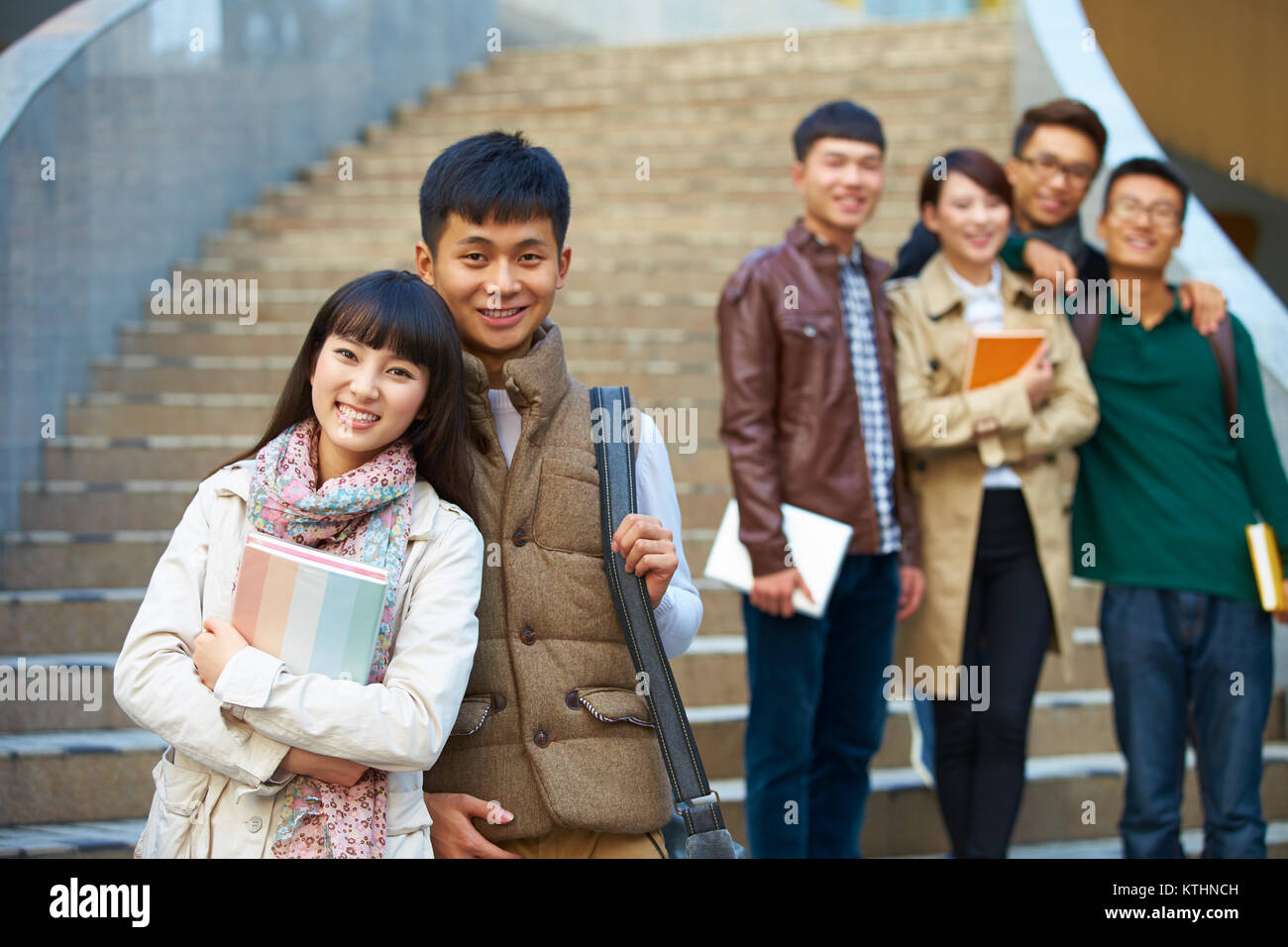 group of happy asian college students looking at camera smile in the ...