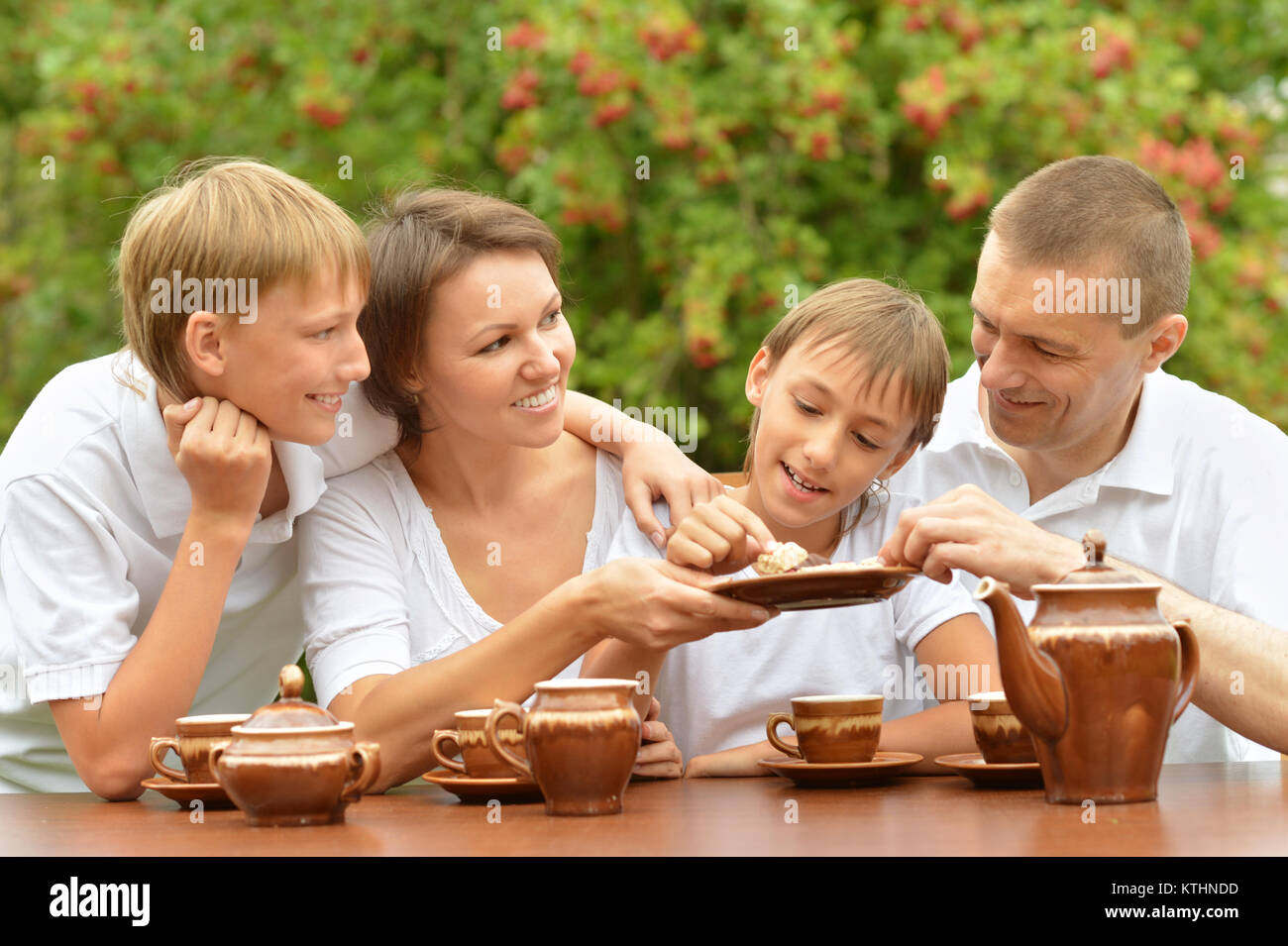 happy family drinking tea Stock Photo - Alamy
