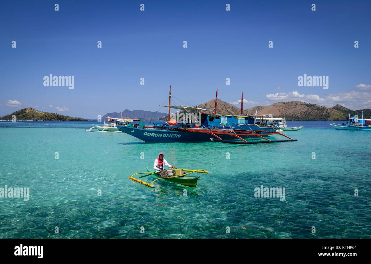 Palawan, Philippines - Apr 11, 2017. A man rowing boat on the sea in ...