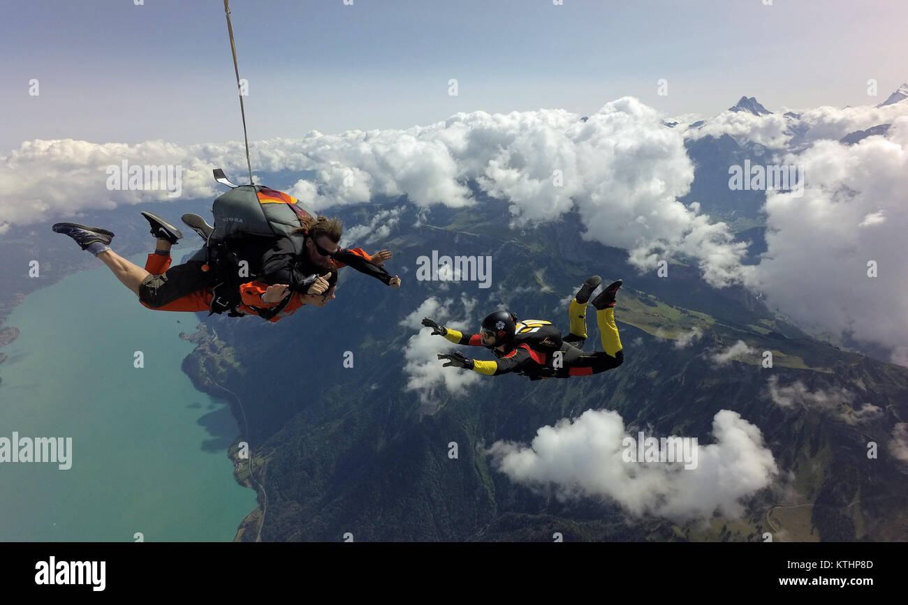 This tandem skydiving couple, plus the fun jumper are enjoying the ...