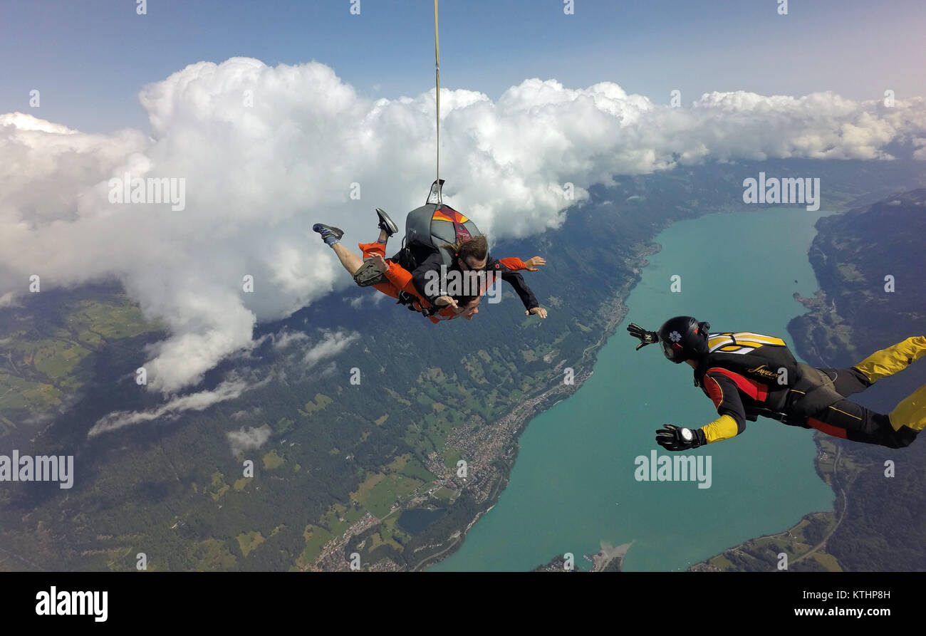 This tandem skydiving couple, plus the fun jumper are enjoying the ...