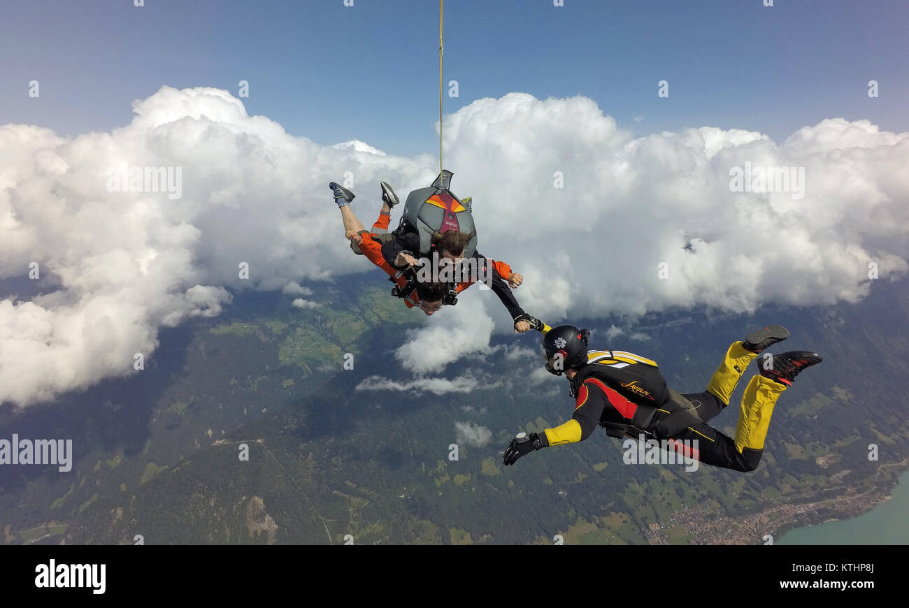 This tandem skydiving couple, plus the fun jumper are enjoying the ...