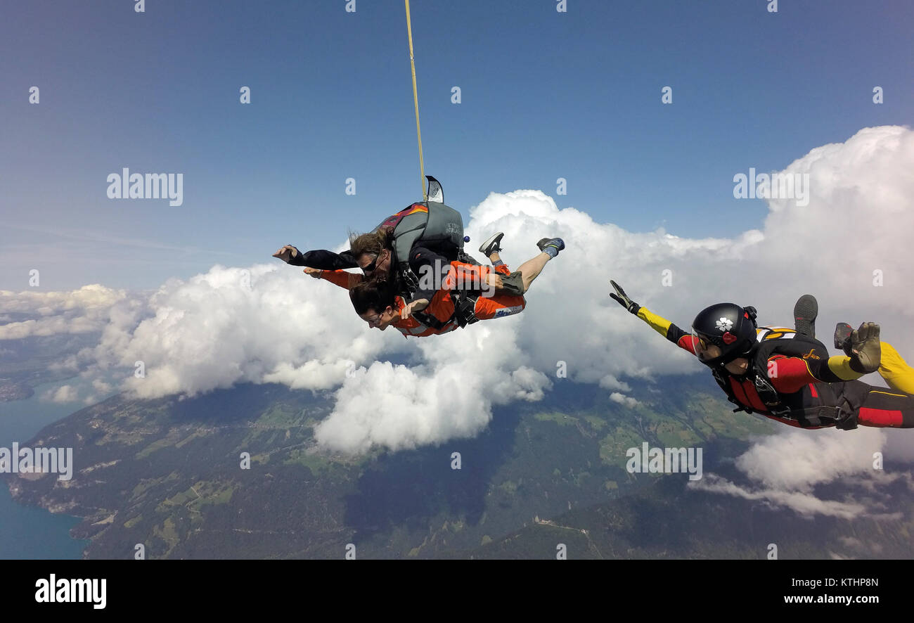 This tandem skydiving couple, plus the fun jumper are enjoying the ...