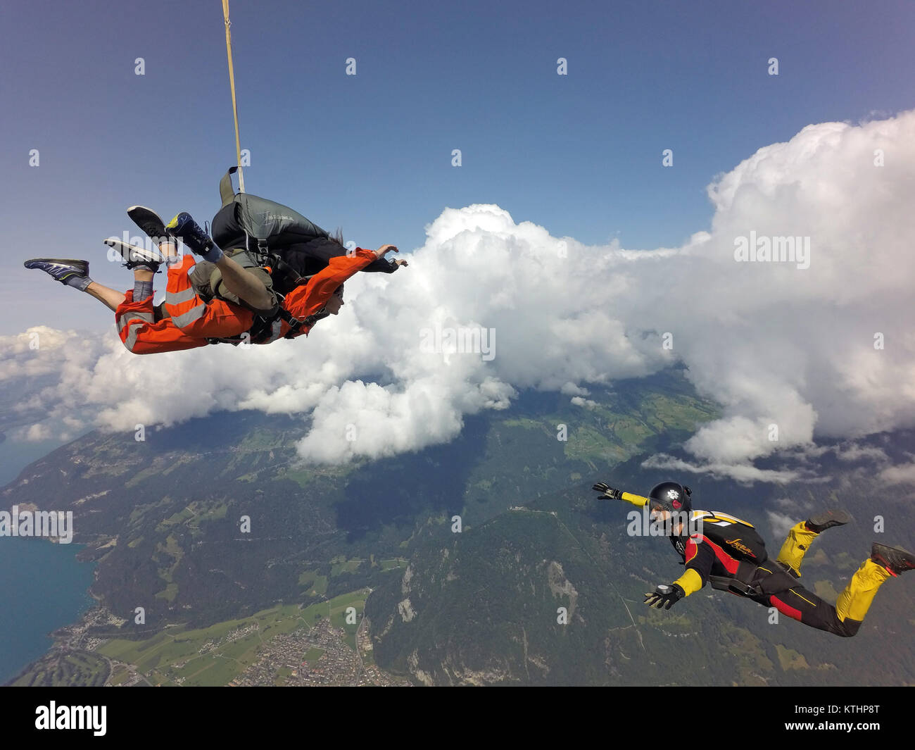 This tandem skydiving couple, plus the fun jumper are enjoying the ...