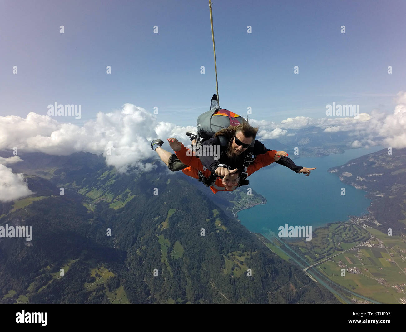 This tandem skydiving team is enjoying the scenic flight over a ...